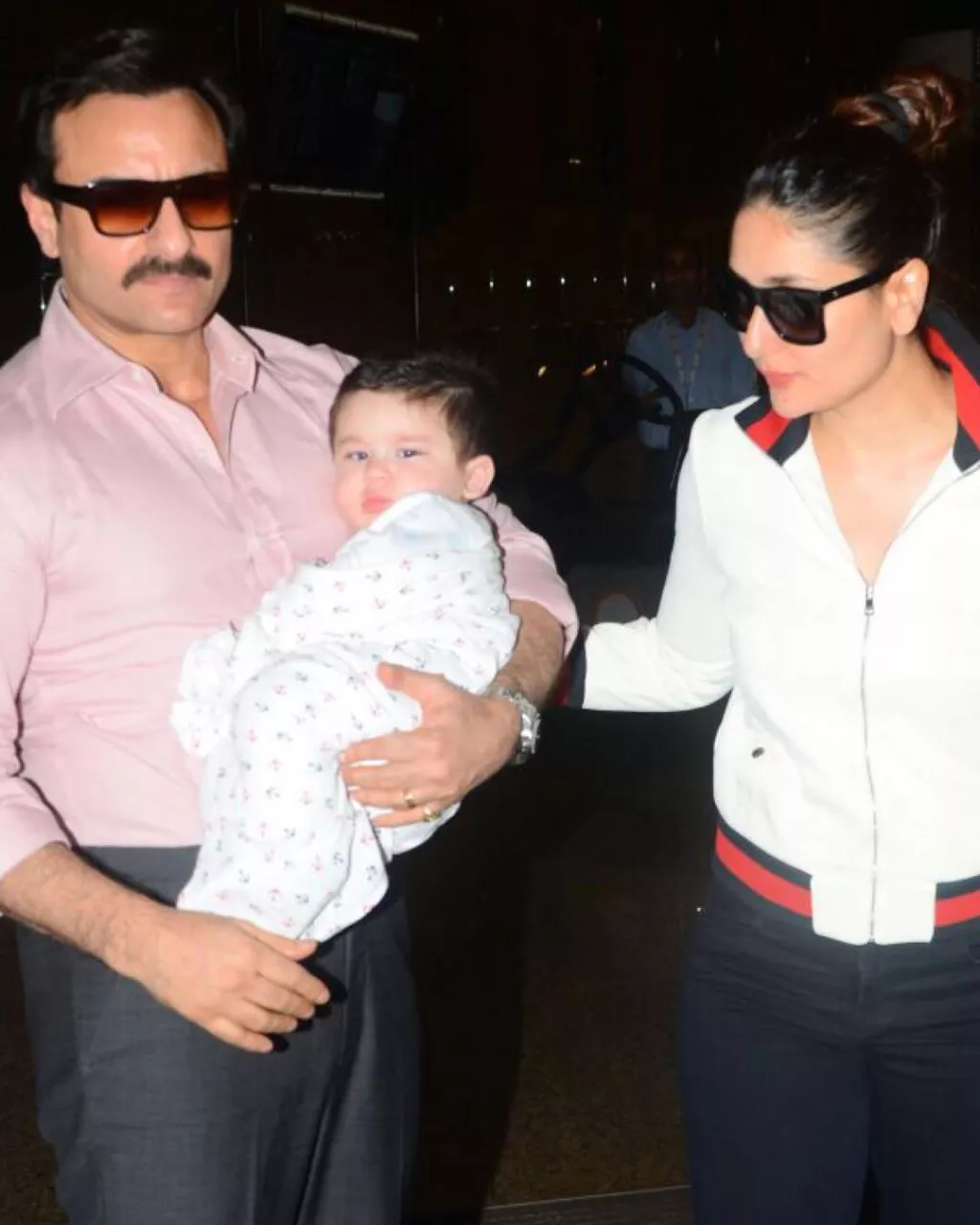 New Pics Of Taimur Sleeping In Daddy Saif's Arms Before Flying To Alps ...