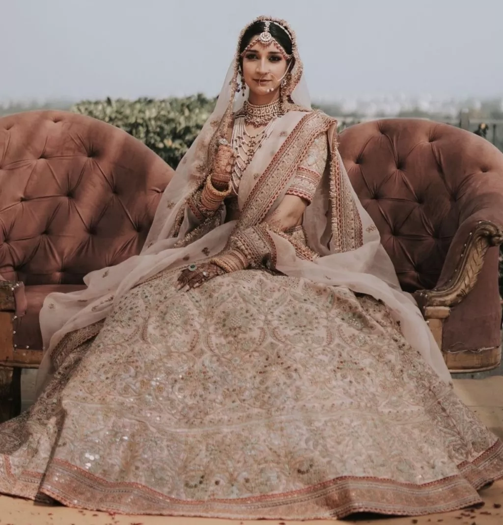Sabyasachi Bride Looks Eternal In A 'Meenakari' Lehenga, Paired With A Layered Pearl Necklace