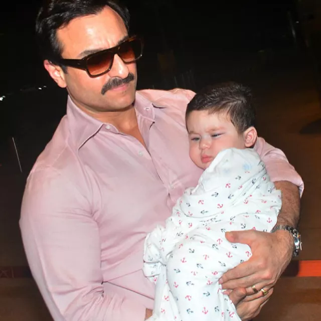 New Pics Of Taimur Sleeping In Daddy Saif's Arms Before Flying To Alps ...