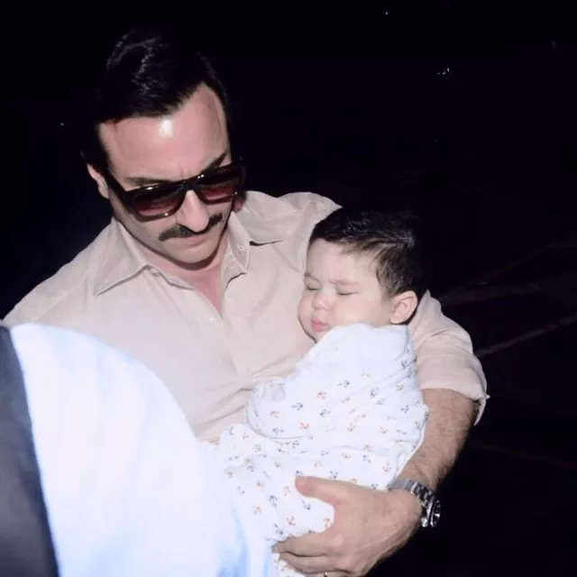 New Pics Of Taimur Sleeping In Daddy Saif's Arms Before Flying To Alps ...